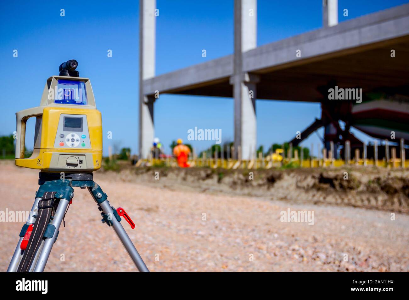 Total center device on tripod with laser for leveling other devices to ...