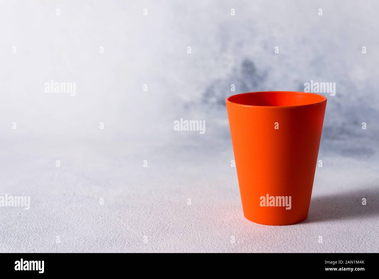 group color plastic cups on gray stone background plastic waste Stock ...