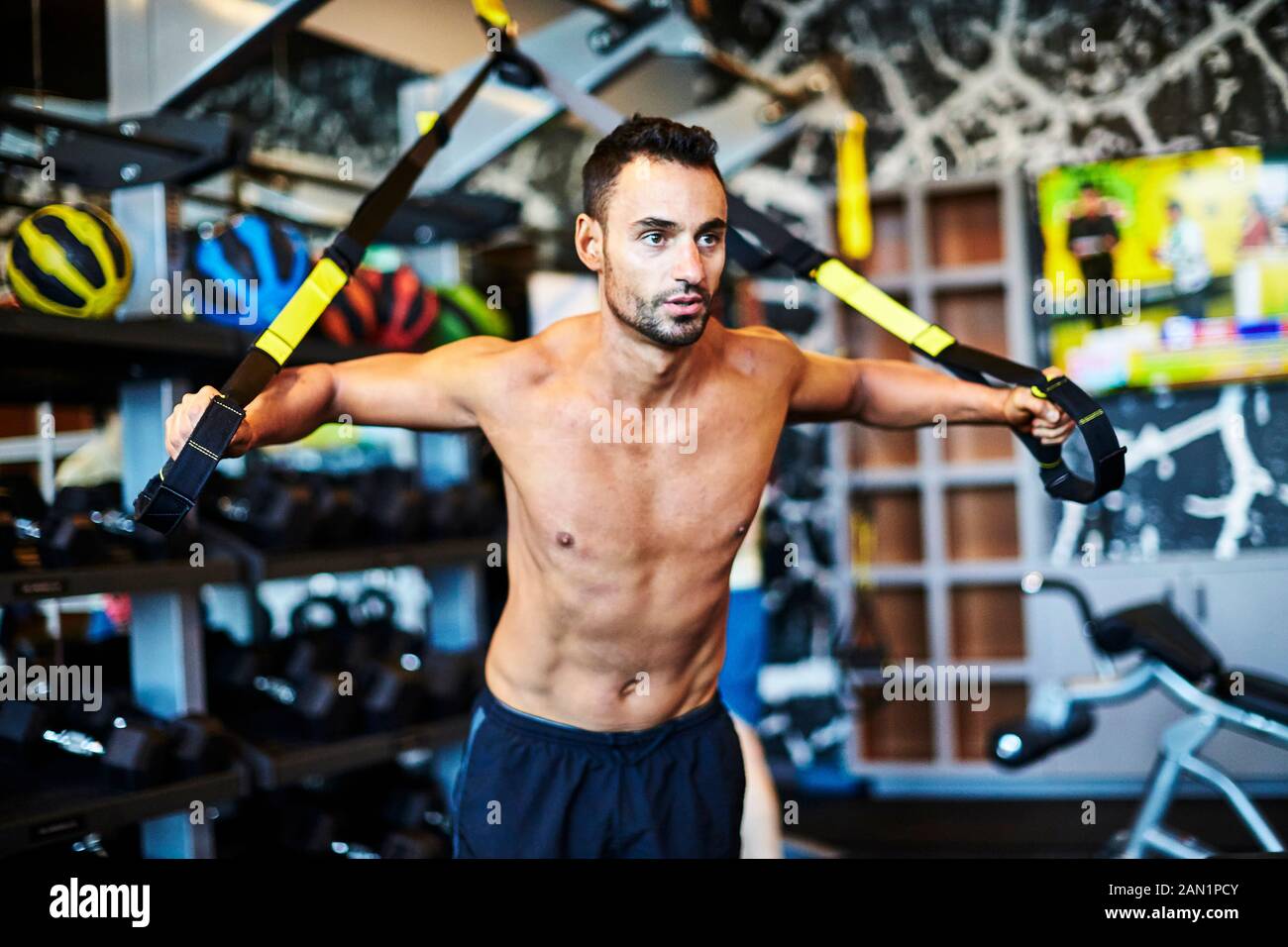 A fit man working out at the gym Stock Photo - Alamy