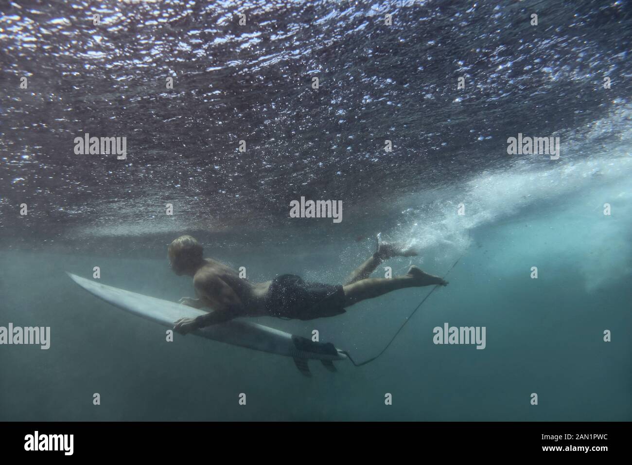 surfer on surfboard, underwater shot Stock Photo - Alamy