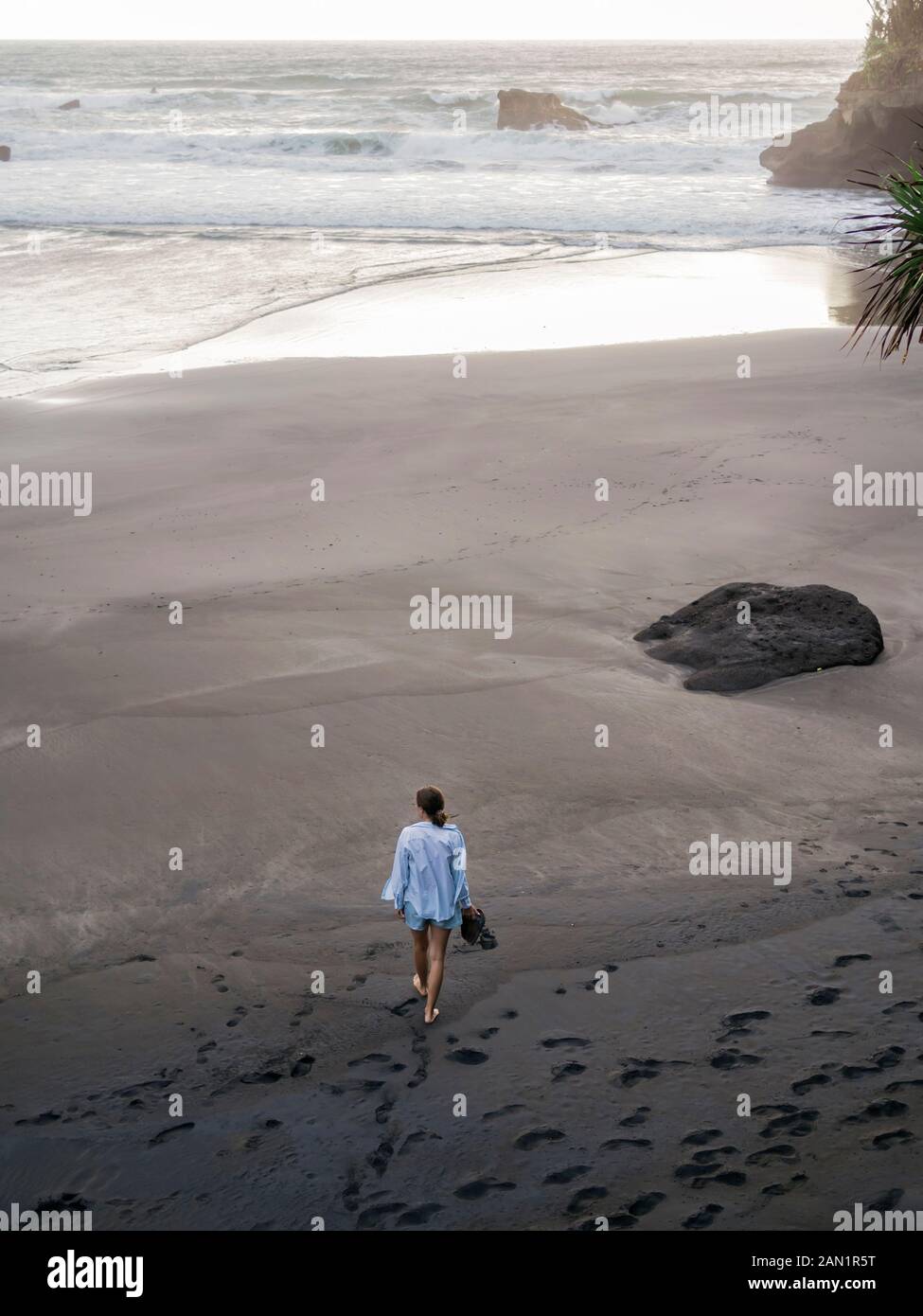 Rear view of a woman on the beach hi-res stock photography and images ...