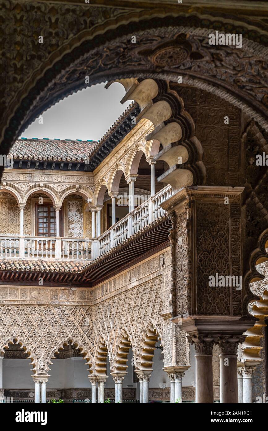 The elaborate Mudejar multifoil arches and ornate stuccowork pillars of ...