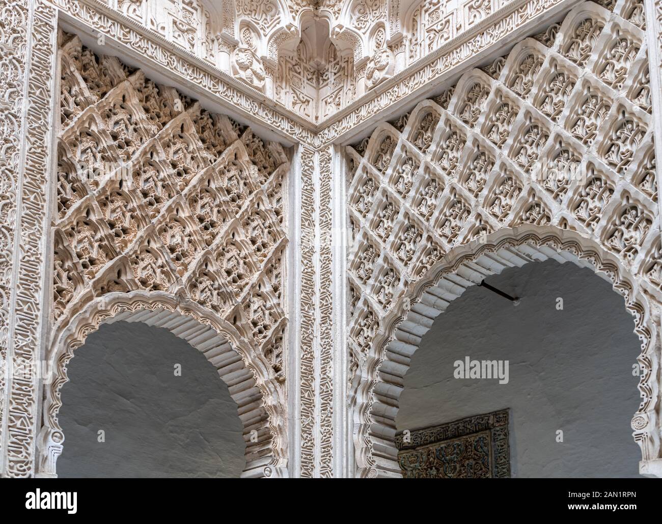 Decorated multifoil horseshoe arches and diamond shaped sebka panels ...