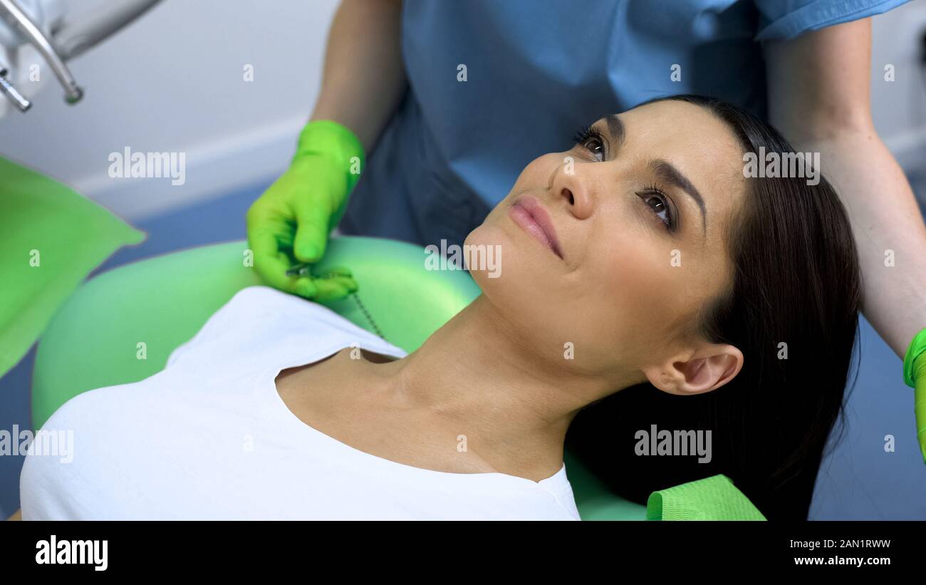 Beautiful female visiting dental clinic for routine check-up, healthy ...