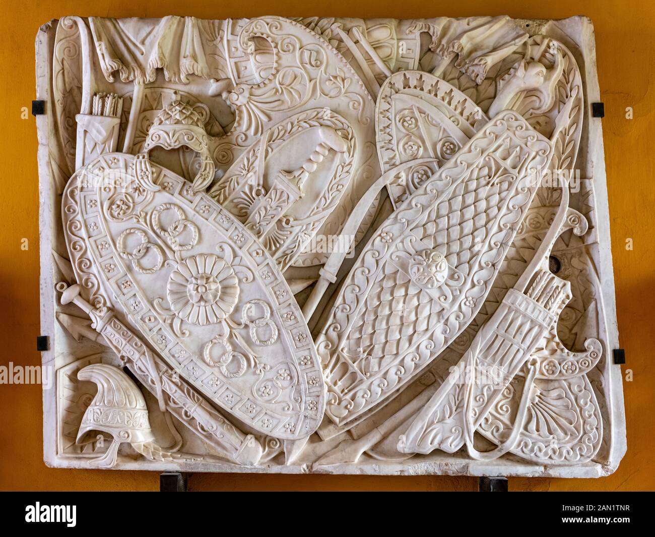 Instruments of war. A beautifully carved tropaion of weapons; one of ...