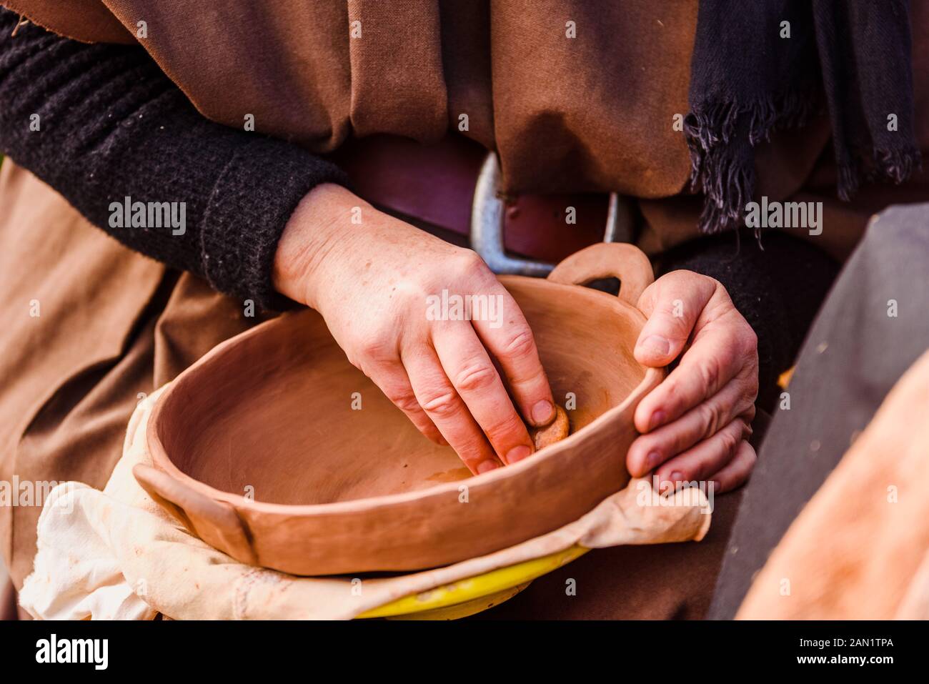 Artisans disguised in medieval times showing old crafts in a festival ...