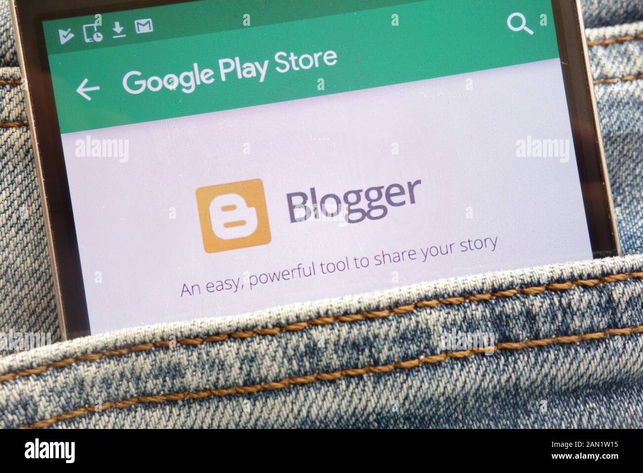 Blogger app on Google Play Store website displayed on smartphone hidden ...