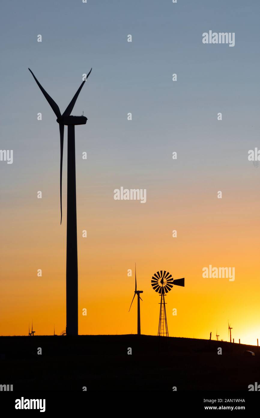 Looking up at wind turbine next to a windmill Stock Photo - Alamy