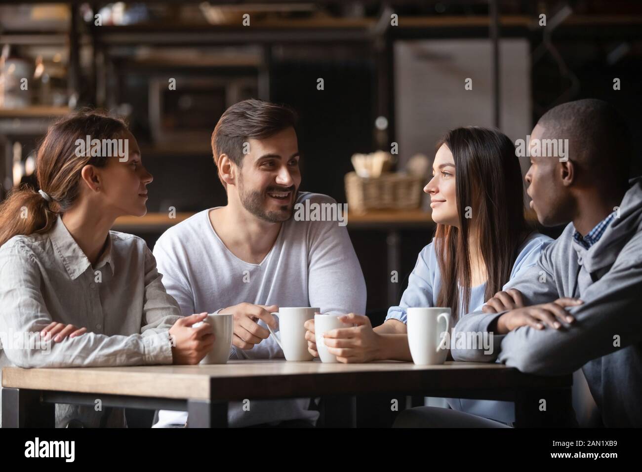 Diverse people laughing together drinking hi-res stock photography and ...