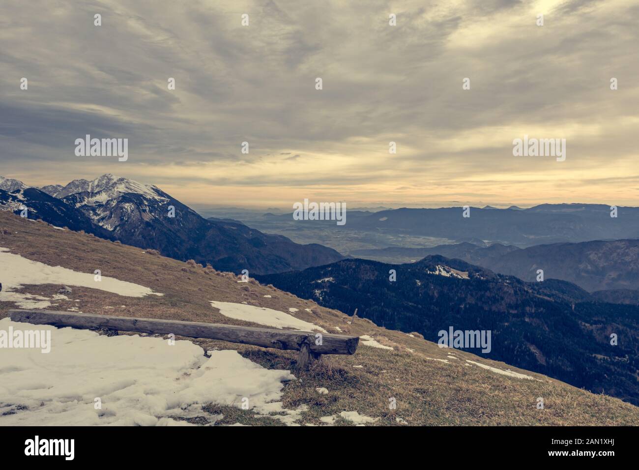 Picturesque mountain view with wooden bench for weary hikers Stock ...