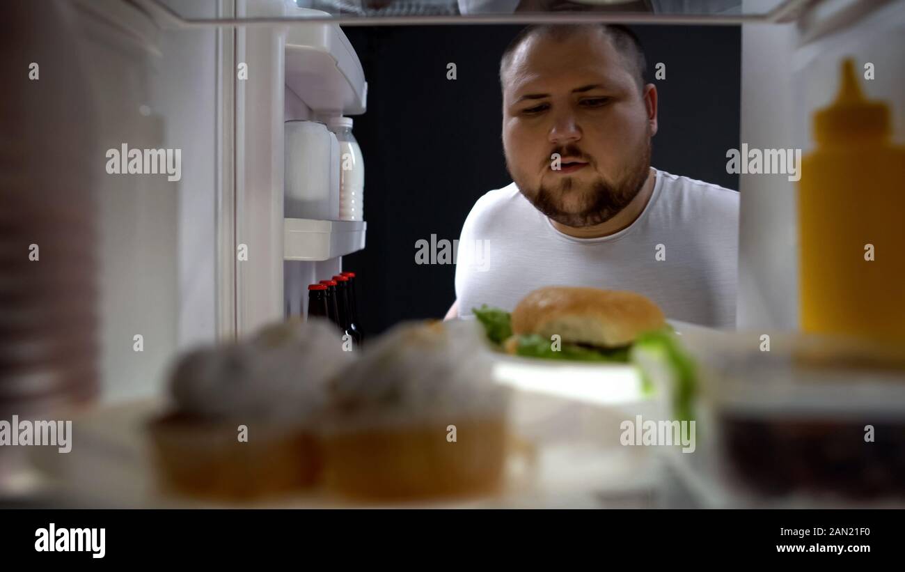 Man opening fridge hi-res stock photography and images - Alamy