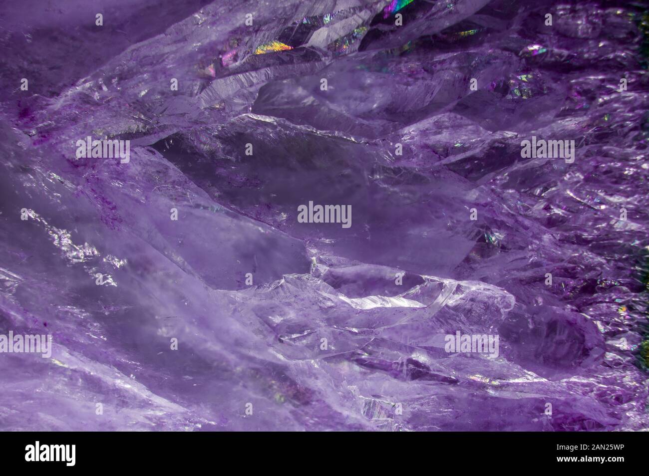 A close up macro photograph of a cut and polished purple agate crystal ...