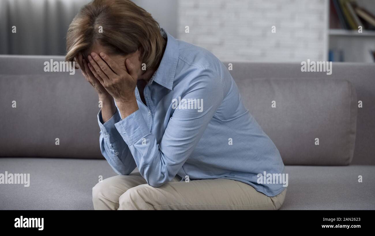 Hands covering face crying female hi-res stock photography and images ...