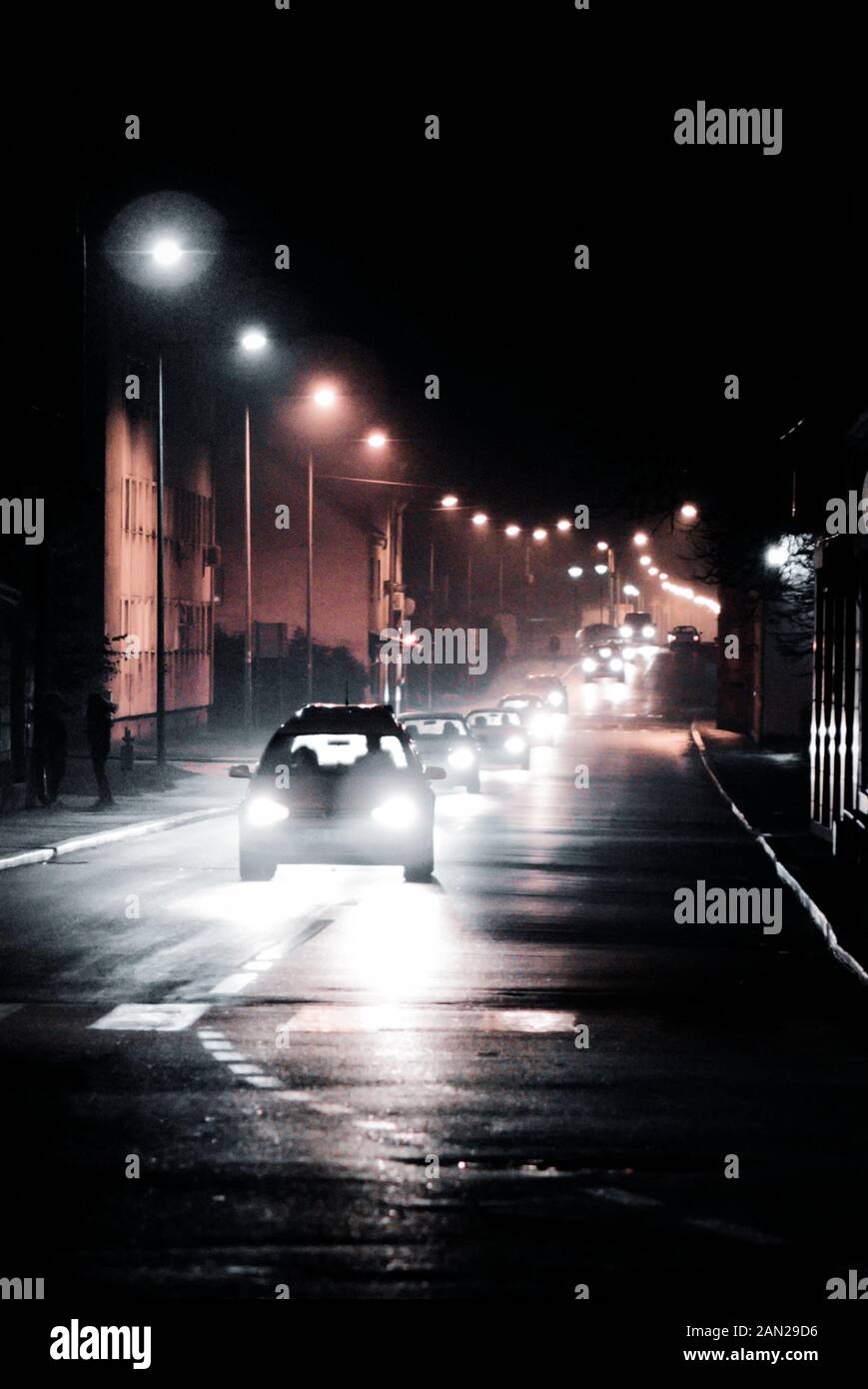 Cars on a road at night Stock Photo - Alamy