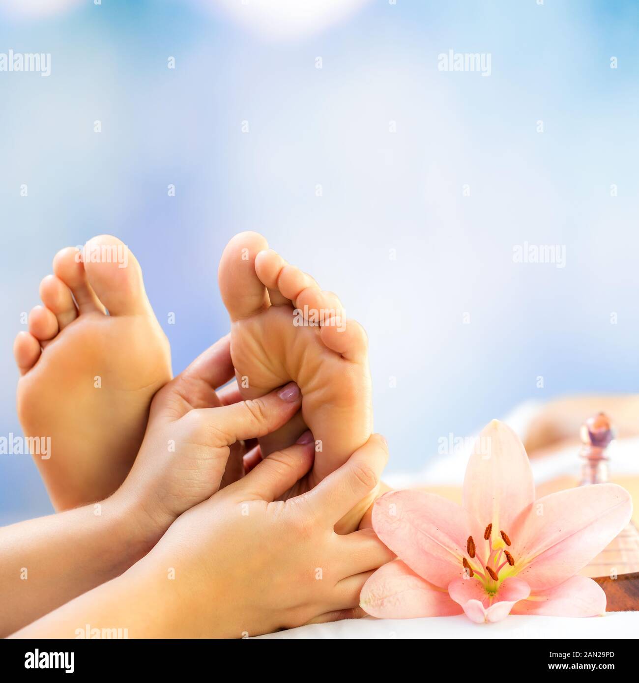Close up foot reflexology. Podiatrist massaging female foot against ...