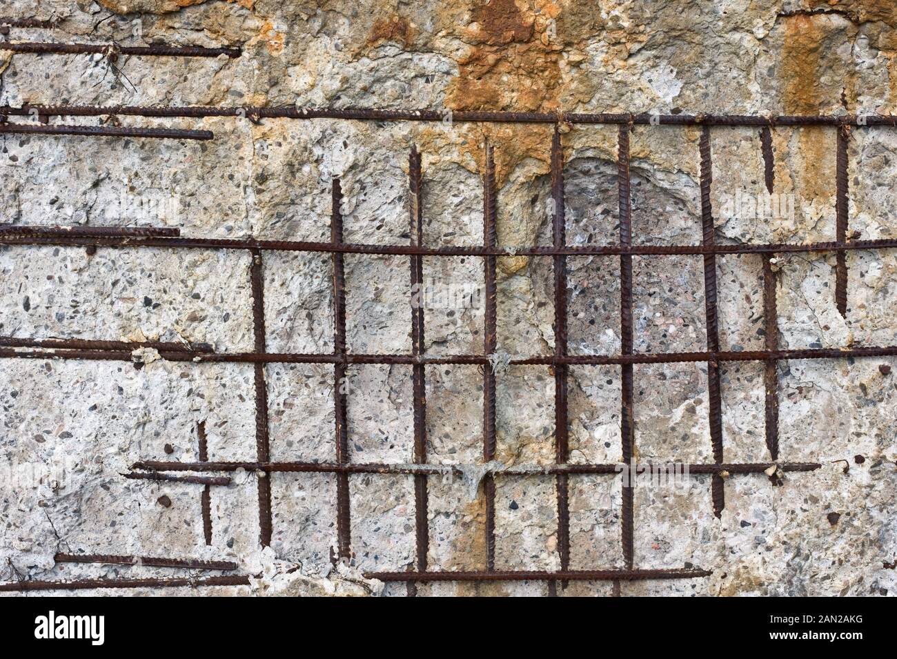 Old damaged and weathered concrete wall with iron rods Stock Photo - Alamy