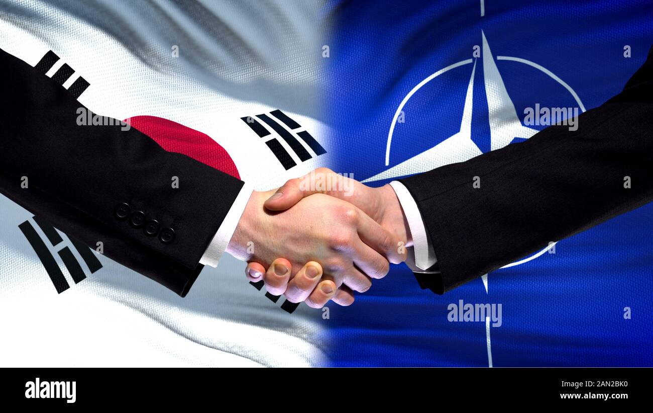 South Korea and NATO handshake, international friendship, flag ...