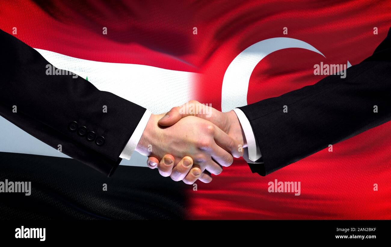 Syria and Turkey handshake, international friendship summit, flag ...
