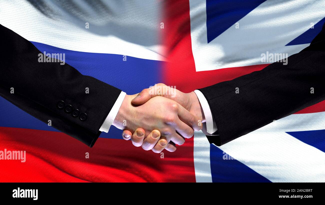 Russia and Great Britain handshake, international friendship, flag ...