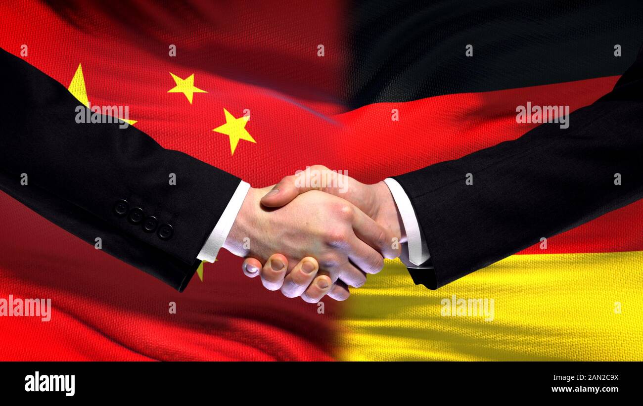 China and Germany handshake, international friendship relations, flag ...