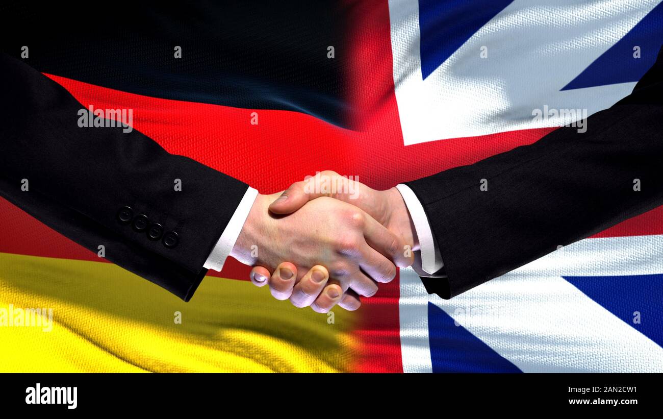 Germany and Great Britain handshake, international friendship, flag ...