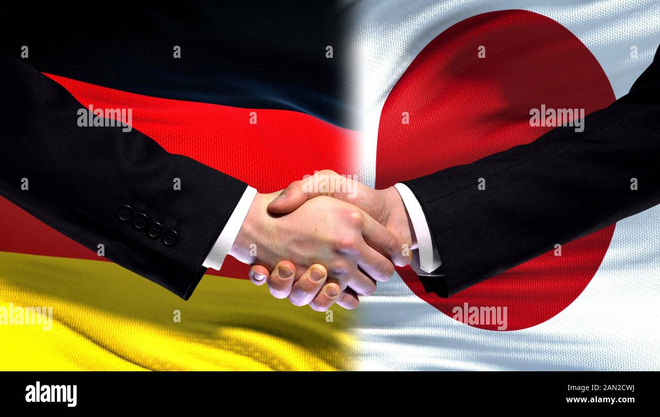 Germany and Japan handshake, international friendship relations, flag ...
