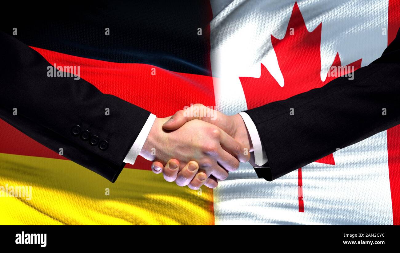 Germany and Canada handshake, international friendship relations flag ...