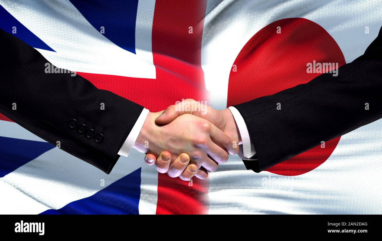 Great Britain and Japan handshake, international friendship, flag ...