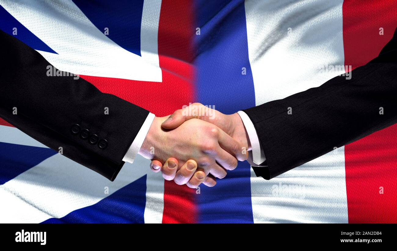 Great Britain and France handshake, international friendship, flag ...