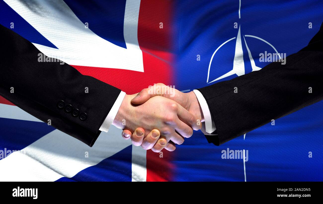 Great Britain and NATO handshake, international friendship, flag ...