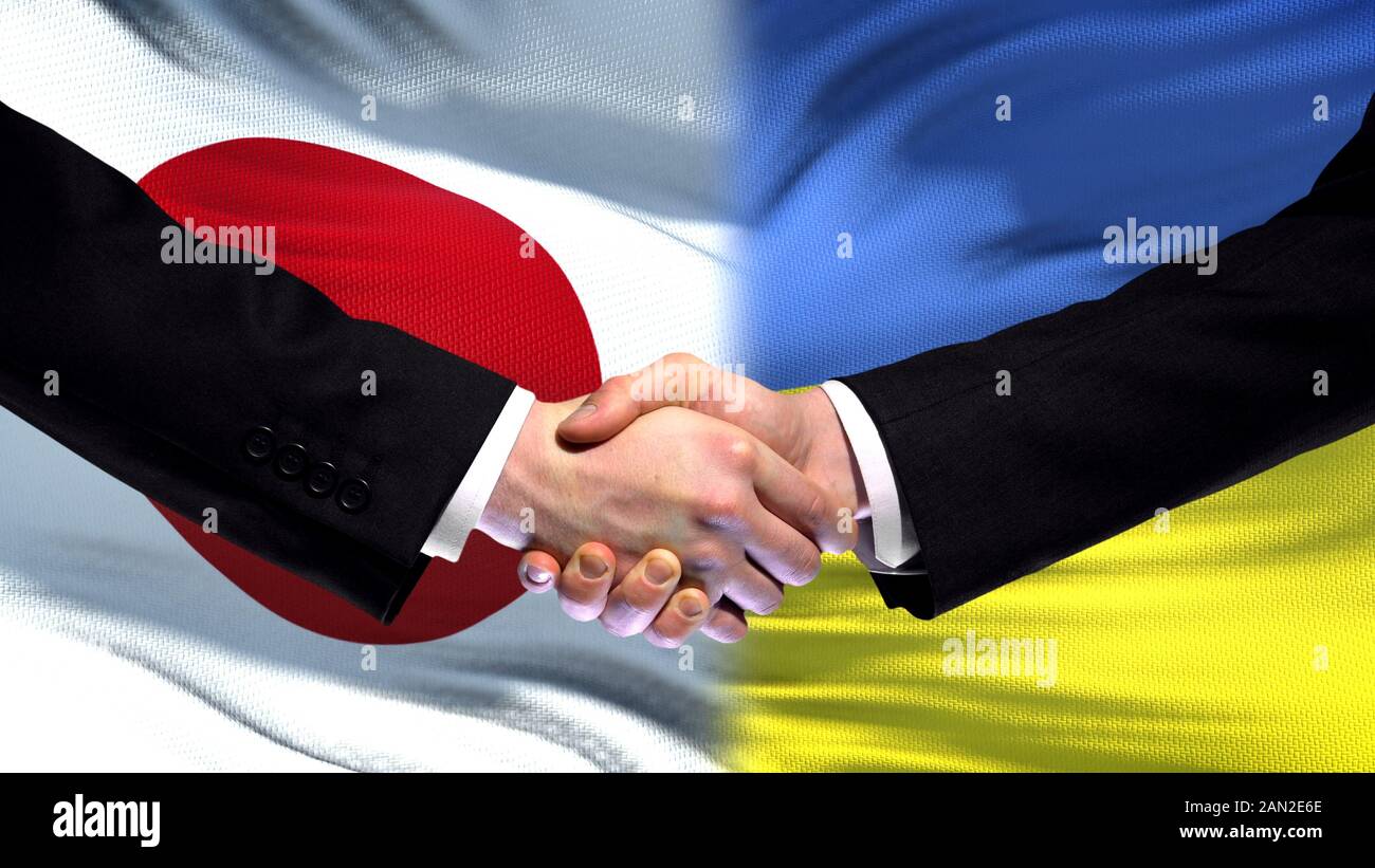 Japan and Ukraine handshake, international friendship relations, flag ...