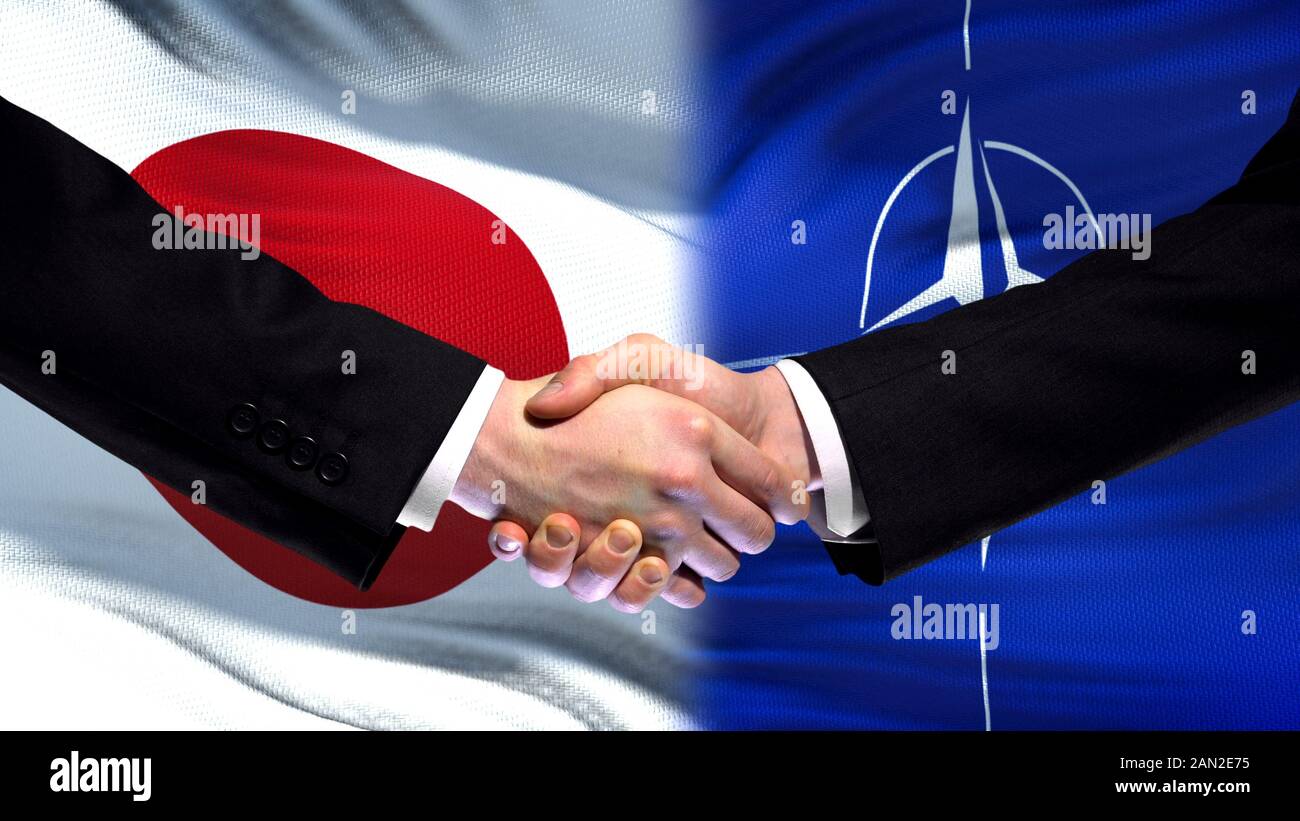 Japan and NATO handshake, international friendship relations, flag ...