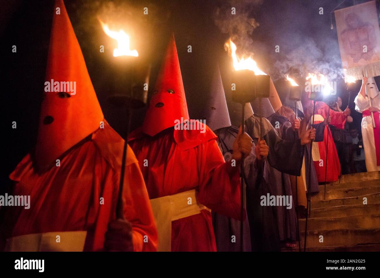 Hooded people make the traditional Fogaréu Procession through the ...