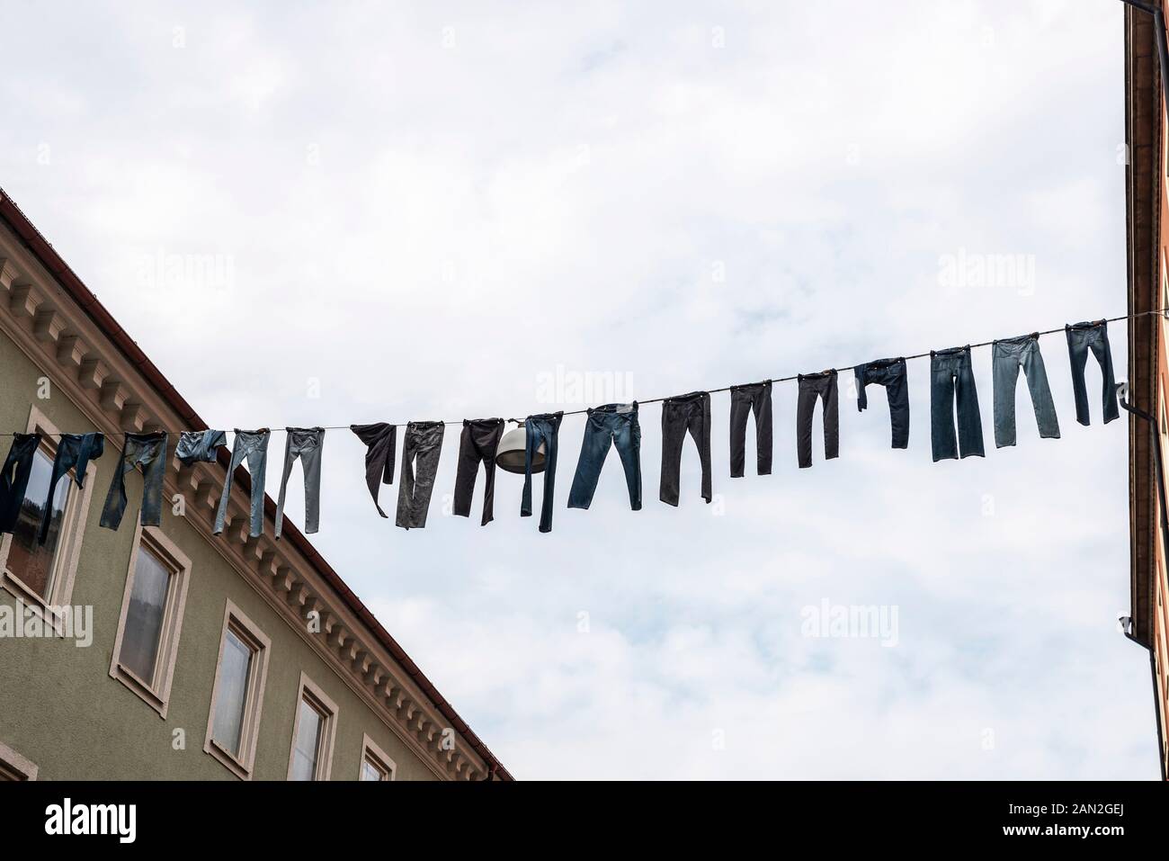 Hanging street clothesline hi-res stock photography and images - Alamy