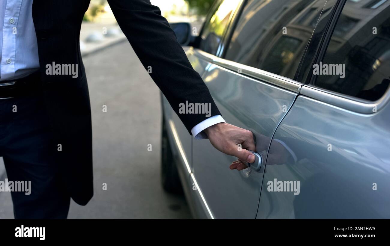 Chauffeur opening car door hi-res stock photography and images - Alamy