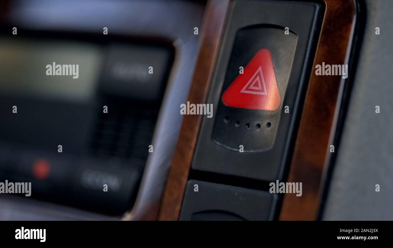 Car hazard warning flasher button on dashboard, emergency situations ...