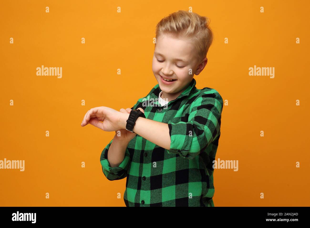 Smartwatch for children. The child is talking on the watch. Beautiful ...