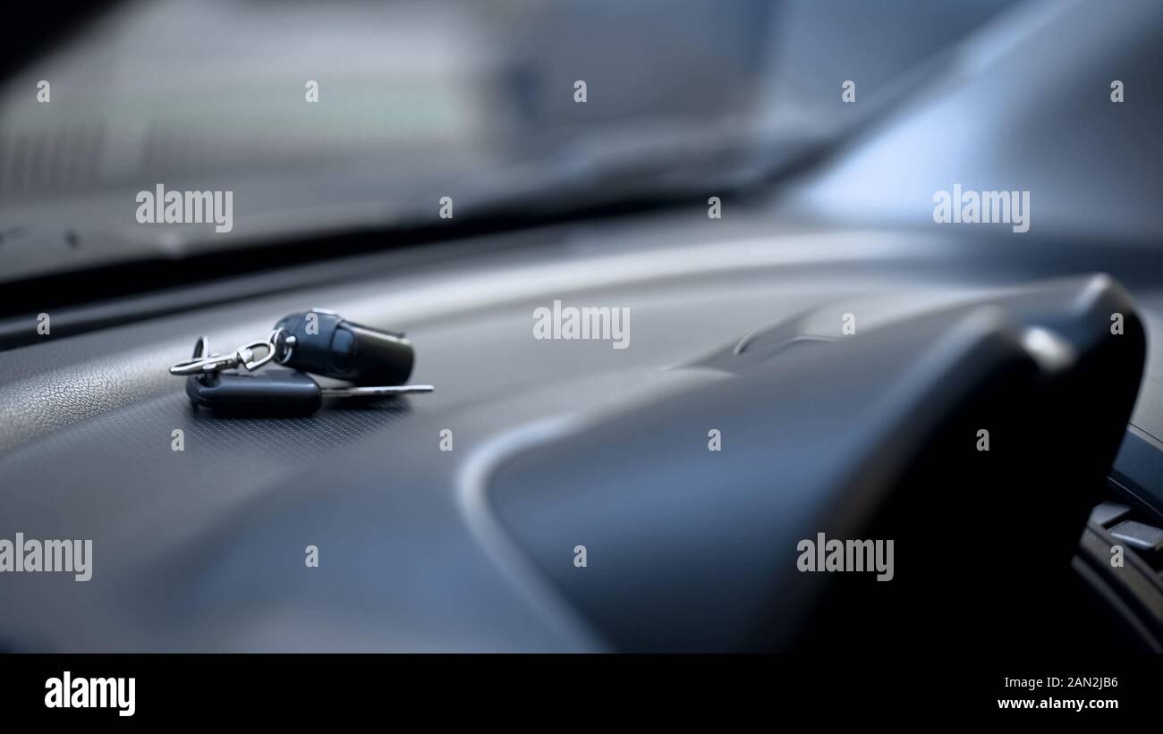 Car keys on dashboard close up, driver leaving parked auto opened, car ...