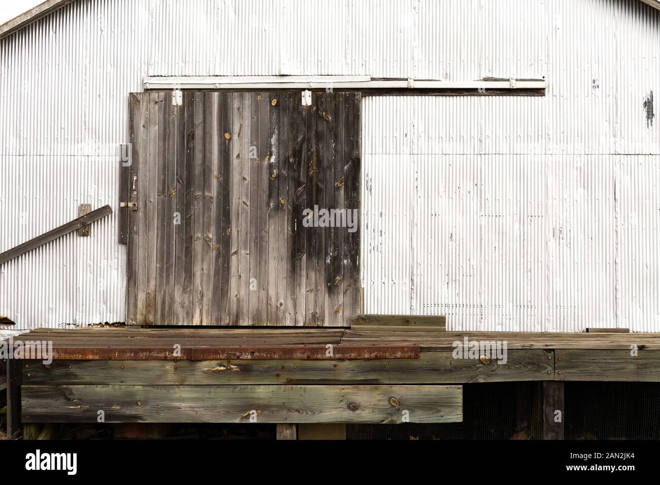 Old wooden door on the loading dock Stock Photo - Alamy