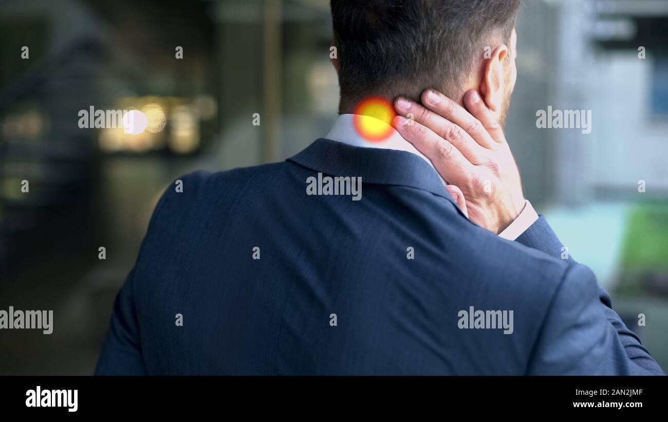 Man suffering from neck pain, muscle spasm, spot indicates inflammation ...