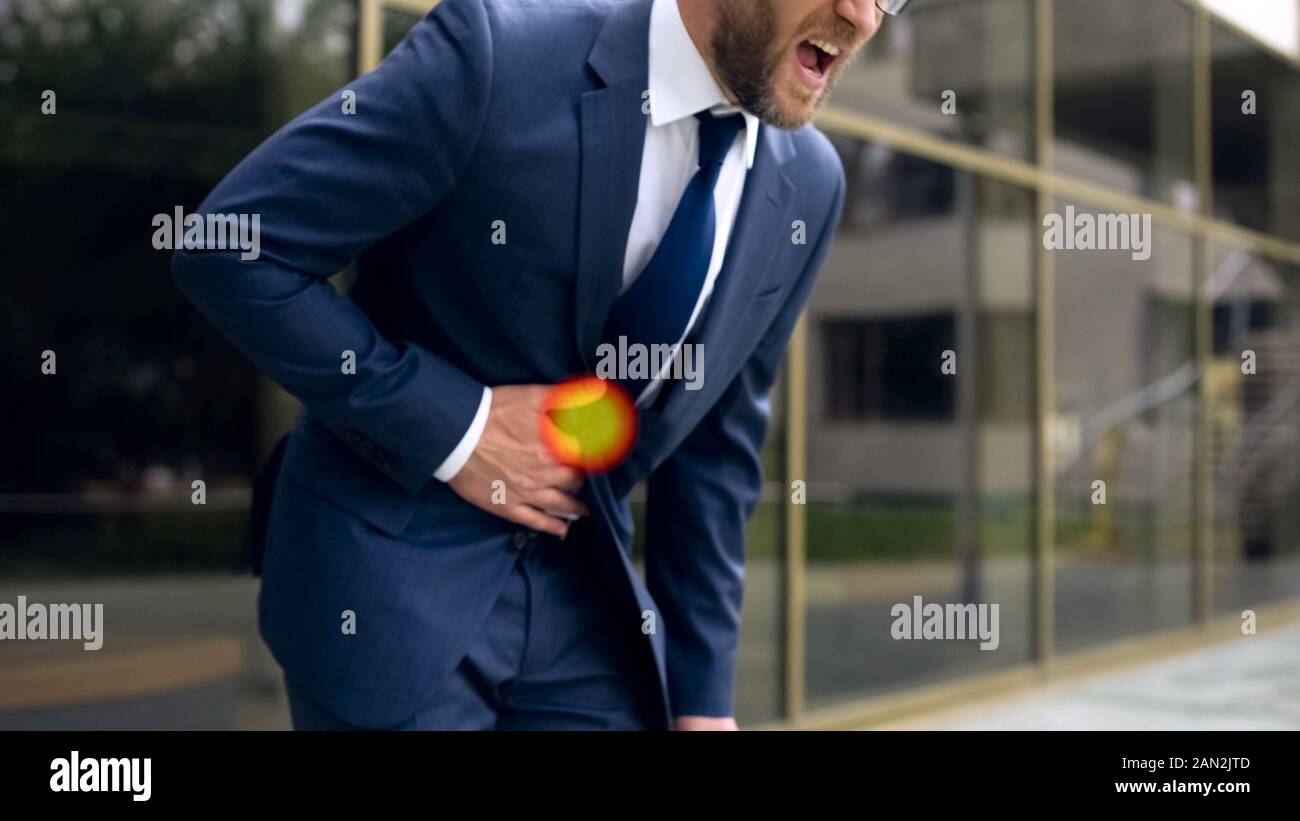 Office manager feels sharp abdominal pain, indigestion, spot indicates ...