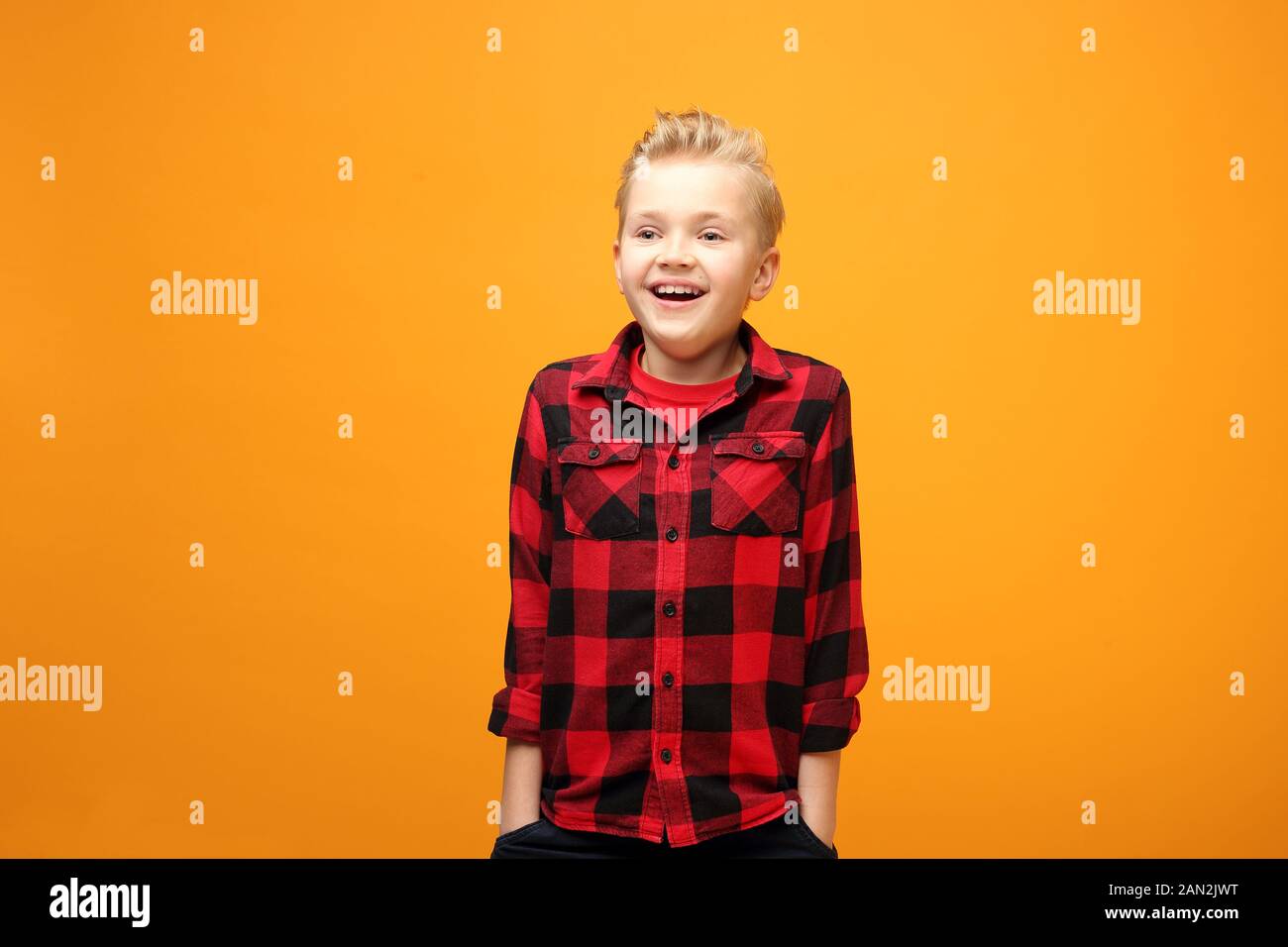 Happiness and joy, emotions of a child. Young handsome smiling ...