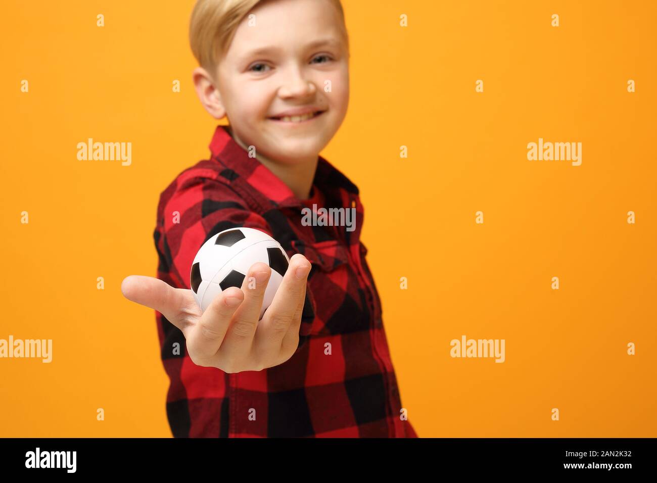 Football, Smiling child with ball.Beautiful smiling caucasian boy in ...
