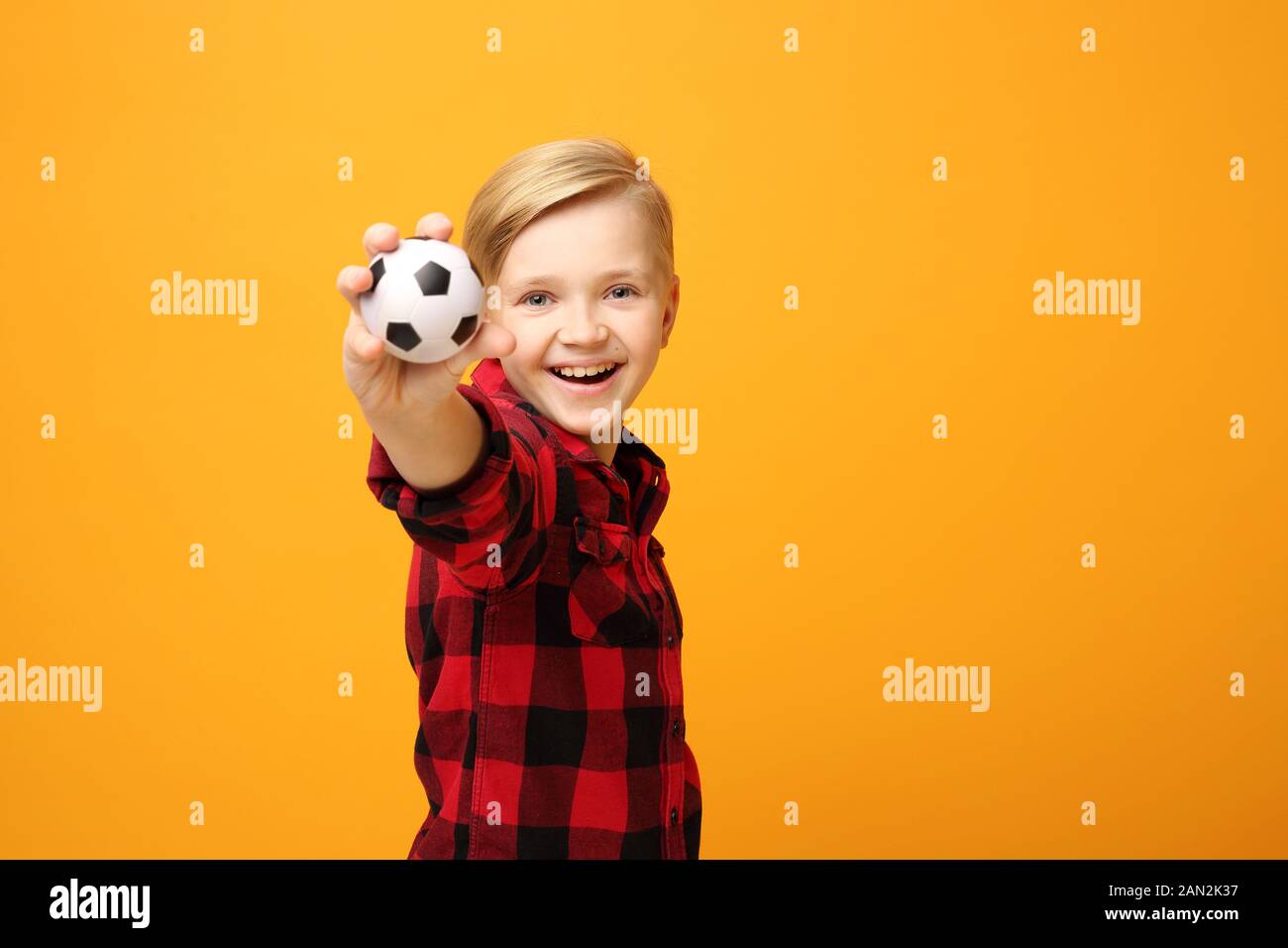 Football, Smiling child with ball.Beautiful smiling caucasian boy in ...