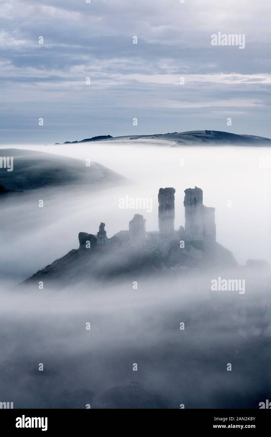 Corfe Castle shrouded in Mist, Dorset, England Stock Photo - Alamy