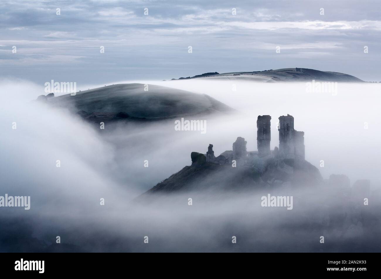 Corfe Castle shrouded in Mist, Dorset, England Stock Photo - Alamy