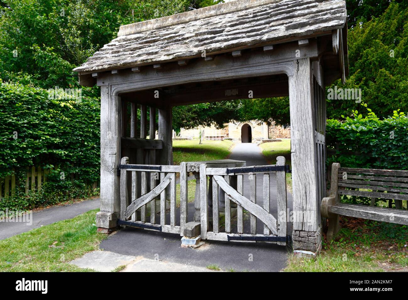 Wooden lychgate at entrance to the old parish church of St Peter ...