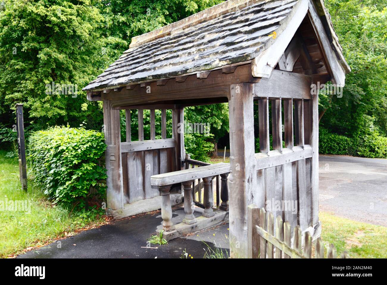 Wooden lychgate at entrance to the old parish church of St Peter ...