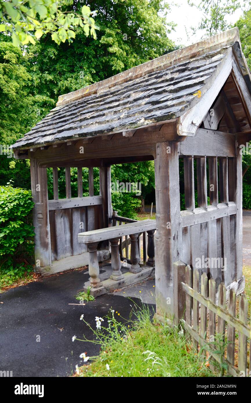 Wooden lychgate at entrance to the old parish church of St Peter ...