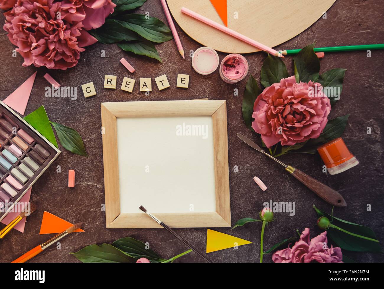 Artist Workspace with Create word typing on wooden blocks, photo frame ...